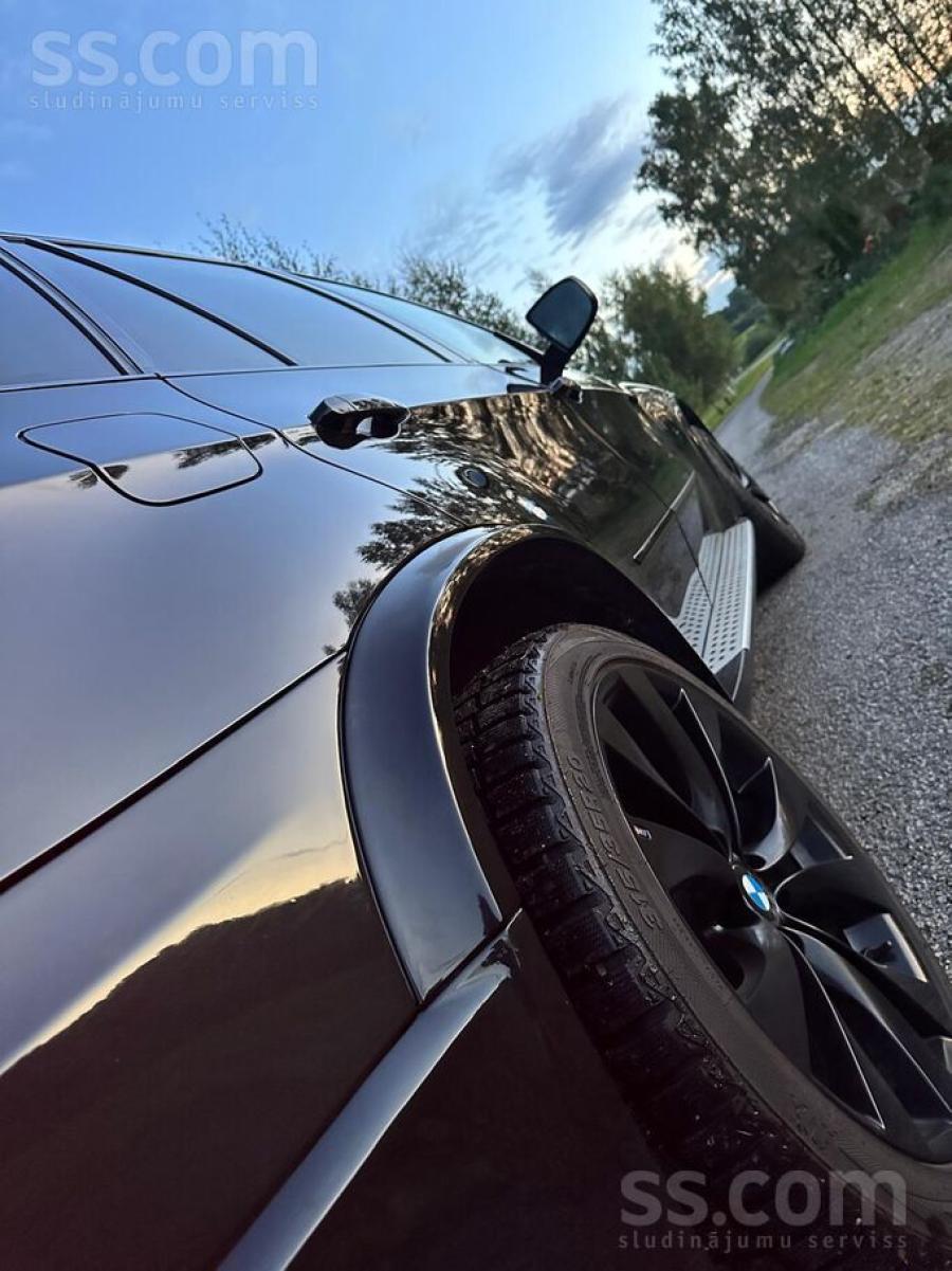 Black BMW X5 2008 in Rezekne, with an engine capacity of 3.00 L and mileage of 396 thousand km for 9300 €, photo 6 on AUTOMOTO.COM.LV