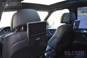 Black BMW X5 2009 in Riga, with an engine capacity of 3.00 L and mileage of 0 thousand km for 9950 €, photo 18 on AUTOMOTO.COM.LV