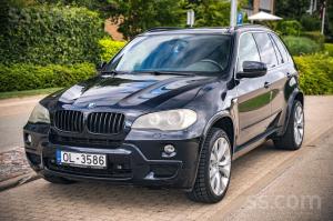Black BMW X5 2009 in Riga, with an engine capacity of 3.00 L and mileage of 318 thousand km for 7590 €, photo  on AUTOMOTO.COM.LV