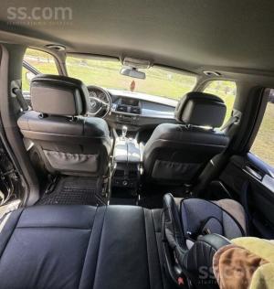 Black BMW X5 2010 in Riga, with an engine capacity of 3.00 L and mileage of 324 thousand km for 8799 €, photo 16 on AUTOMOTO.COM.LV