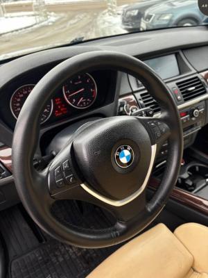 Black BMW X5 2010 in Riga, with an engine capacity of 3.00 L and mileage of 245 thousand km for 11999 €, photo 21 on AUTOMOTO.COM.LV