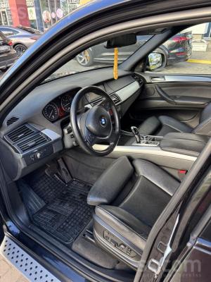 Black BMW X5 2011 in Riga, with an engine capacity of 3.00 L and mileage of 244 thousand km for 12999 €, photo 4 on AUTOMOTO.COM.LV