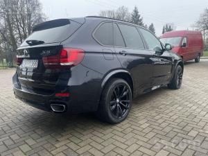 Black BMW X5 2014 in Ogre, with an engine capacity of 3.00 L and mileage of 250 thousand km for 21770 €, photo 4 on AUTOMOTO.COM.LV