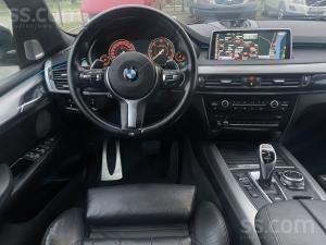 Black BMW X5 2014 in Ogre, with an engine capacity of 3.00 L and mileage of 250 thousand km for 21770 €, photo 12 on AUTOMOTO.COM.LV