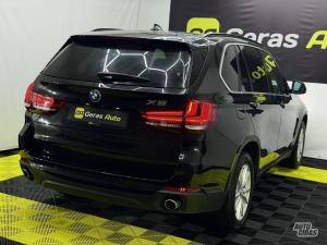 Black BMW X5 2014 in Avizieniai, with an engine capacity of 3.00 L and mileage of 213 thousand km for 17000 €, photo 4 on AUTOMOTO.COM.LV