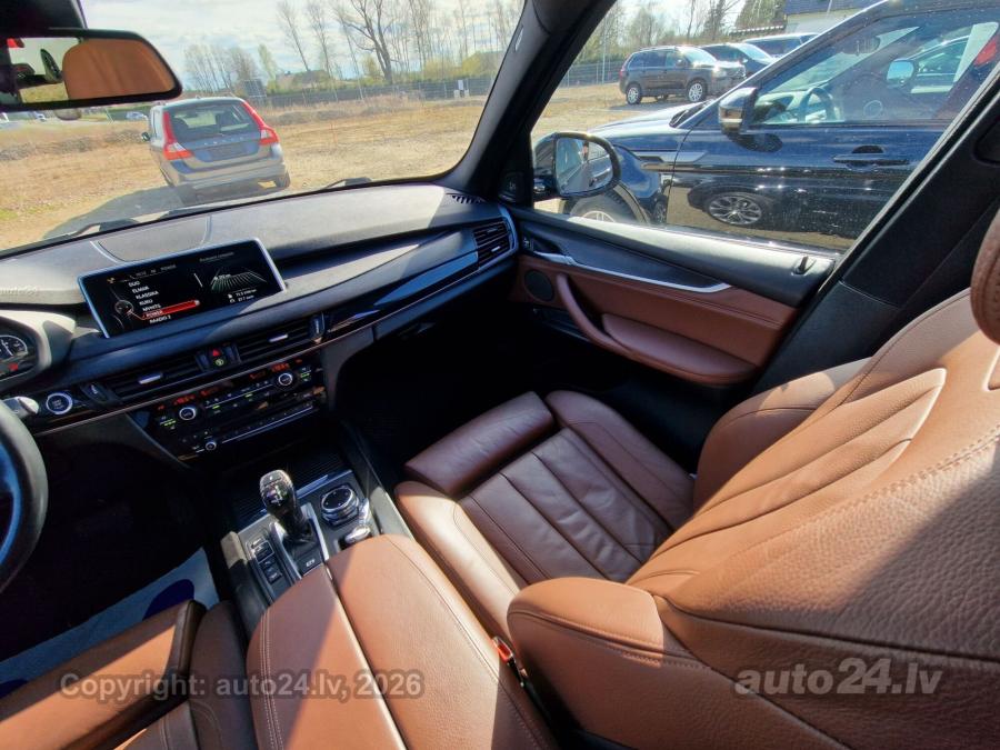 Black BMW X5 2014 in Tartu, with an engine capacity of 3.00 L and mileage of 228 thousand km for 23490 €, photo 23 on AUTOMOTO.COM.LV
