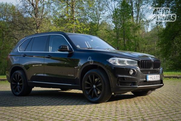 Black BMW X5 2014 in Vilnius, with an engine capacity of 3.50 L and mileage of 201 thousand km for 18999 €, photo 4 on AUTOMOTO.COM.LV