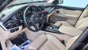 Black BMW X5 2014 in Riga, with an engine capacity of 3.00 L and mileage of 206 thousand km for 16950 €, photo 26 on AUTOMOTO.COM.LV