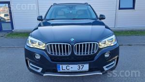 Black BMW X5 2014 in Riga, with an engine capacity of 2.00 L and mileage of 209 thousand km for 20950 €, photo 4 on AUTOMOTO.COM.LV