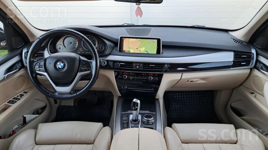 Black BMW X5 2014 in Riga, with an engine capacity of 2.00 L and mileage of 209 thousand km for 20950 €, photo 12 on AUTOMOTO.COM.LV