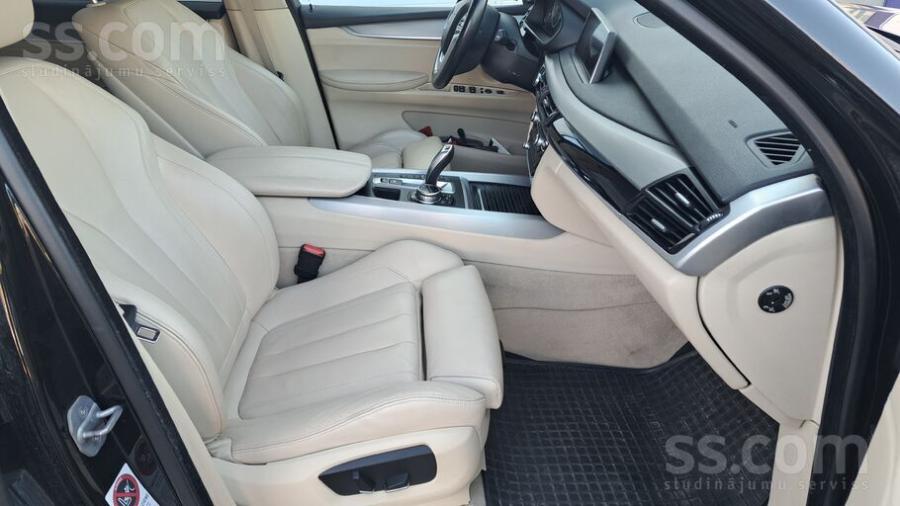 Black BMW X5 2014 in Riga, with an engine capacity of 2.00 L and mileage of 209 thousand km for 20950 €, photo 14 on AUTOMOTO.COM.LV