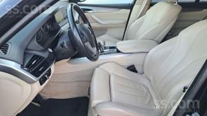 Black BMW X5 2014 in Riga, with an engine capacity of 2.00 L and mileage of 209 thousand km for 20950 €, photo 15 on AUTOMOTO.COM.LV