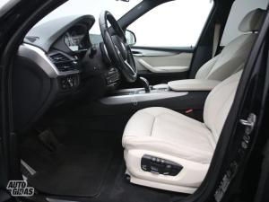 Black BMW X5 2014 in Vilnius, with an engine capacity of 3.00 L and mileage of 205 thousand km for 22999 €, photo 5 on AUTOMOTO.COM.LV