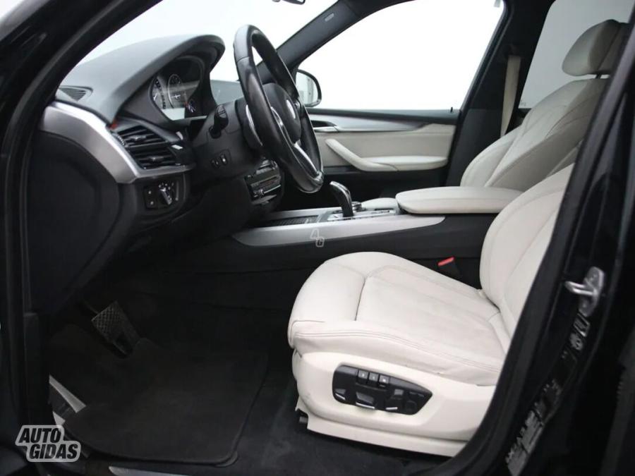 Black BMW X5 2014 in Vilnius, with an engine capacity of 3.00 L and mileage of 205 thousand km for 22999 €, photo 5 on AUTOMOTO.COM.LV