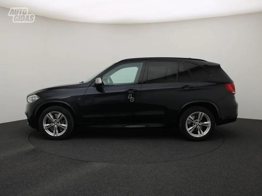 Black BMW X5 2014 in Vilnius, with an engine capacity of 3.00 L and mileage of 205 thousand km for 22999 €, photo 7 on AUTOMOTO.COM.LV