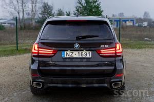 Black BMW X5 2014 in Riga, with an engine capacity of 3.00 L and mileage of 0 thousand km for 24290 €, photo 6 on AUTOMOTO.COM.LV