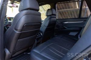 Black BMW X5 2014 in Riga, with an engine capacity of 3.00 L and mileage of 0 thousand km for 24290 €, photo 12 on AUTOMOTO.COM.LV