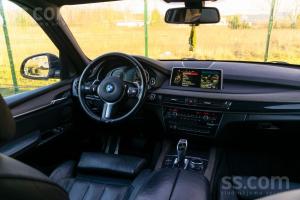Black BMW X5 2014 in Riga, with an engine capacity of 3.00 L and mileage of 0 thousand km for 24290 €, photo 15 on AUTOMOTO.COM.LV