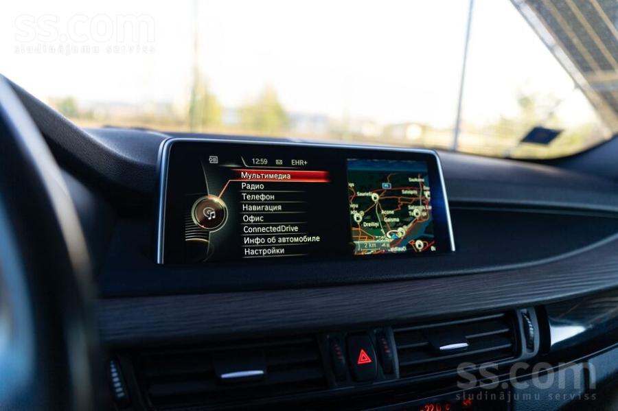 Black BMW X5 2014 in Riga, with an engine capacity of 3.00 L and mileage of 0 thousand km for 24290 €, photo 25 on AUTOMOTO.COM.LV
