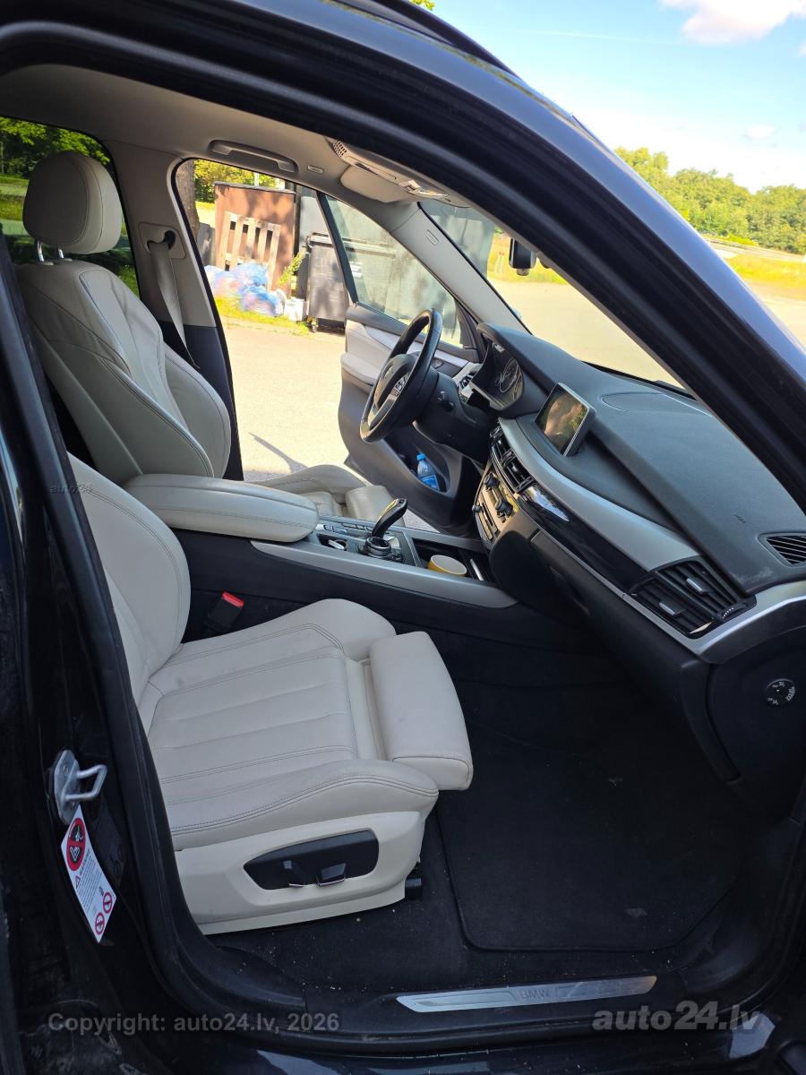 Black BMW X5 2014 in Tallinn, with an engine capacity of 3.00 L and mileage of 433 thousand km for 13640 €, photo 10 on AUTOMOTO.COM.LV