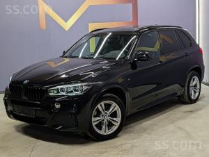 Black BMW X5 2014 in Jurmala, with an engine capacity of 3.00 L and mileage of 263 thousand km for 22950 €, photo 4 on AUTOMOTO.COM.LV