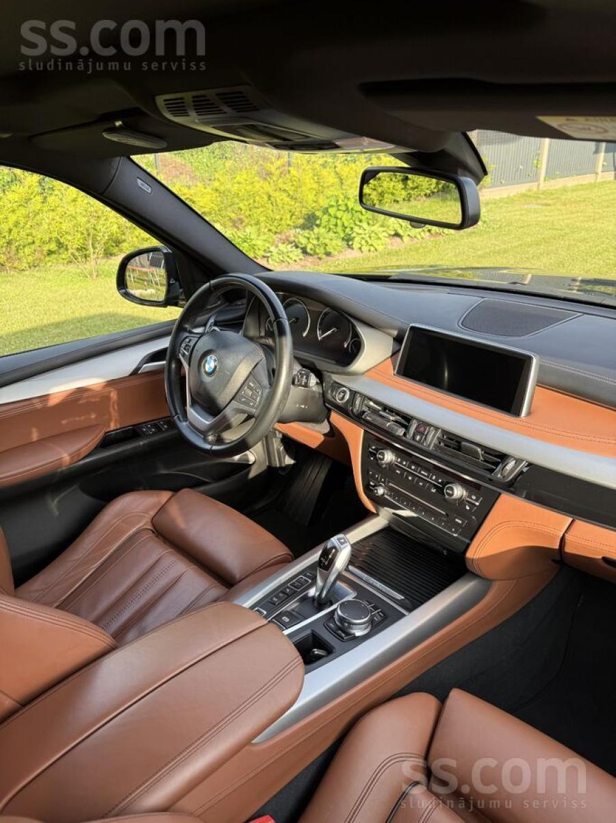Black BMW X5 2018 in Riga, with an engine capacity of 2.00 L and mileage of 106 thousand km for 25000 €, photo 7 on AUTOMOTO.COM.LV