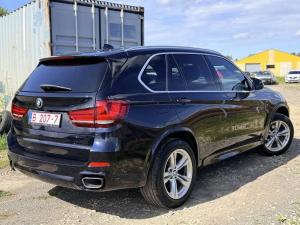 Blue BMW X5 2014 in Riga, with an engine capacity of 2.00 L and mileage of 259 thousand km for 18995 €, photo 7 on AUTOMOTO.COM.LV