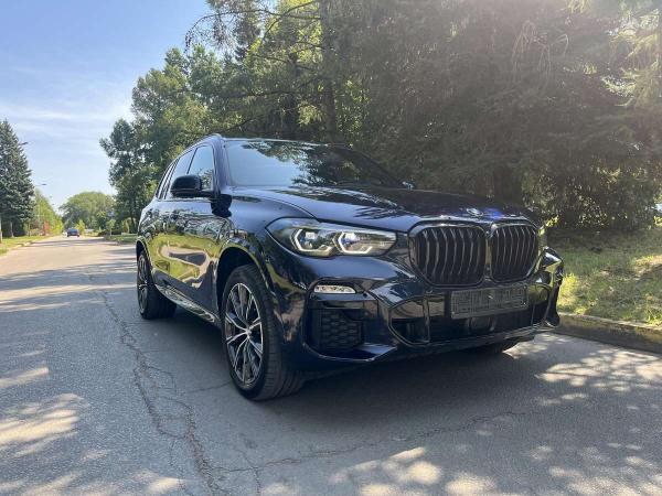 Blue BMW X5 2022 in Panevezys, with an engine capacity of 3.00 L and mileage of 143 thousand km for 42250 €, photo 1 on AUTOMOTO.COM.LV