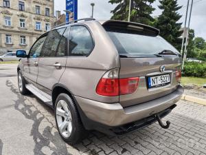 Brown BMW X5 2005 in Riga, with an engine capacity of 4.40 L and mileage of 0 thousand km for 5500 €, photo 5 on AUTOMOTO.COM.LV