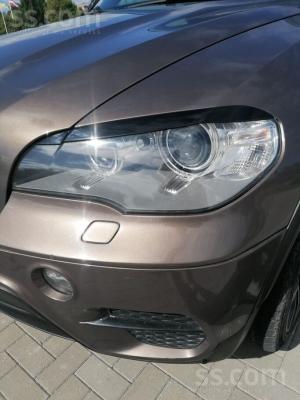 Brown BMW X5 2010 in Riga, with an engine capacity of 3.00 L and mileage of 303 thousand km for 14700 €, photo 15 on AUTOMOTO.COM.LV