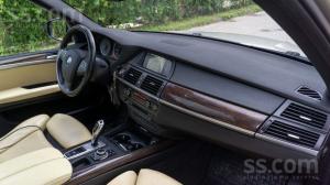 Brown BMW X5 2012 in Riga, with an engine capacity of 3.00 L and mileage of 233 thousand km for 11490 €, photo 11 on AUTOMOTO.COM.LV