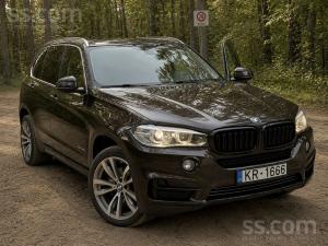 Brown BMW X5 2014 in Riga, with an engine capacity of 2.00 L and mileage of 196 thousand km for 19190 €, photo 4 on AUTOMOTO.COM.LV