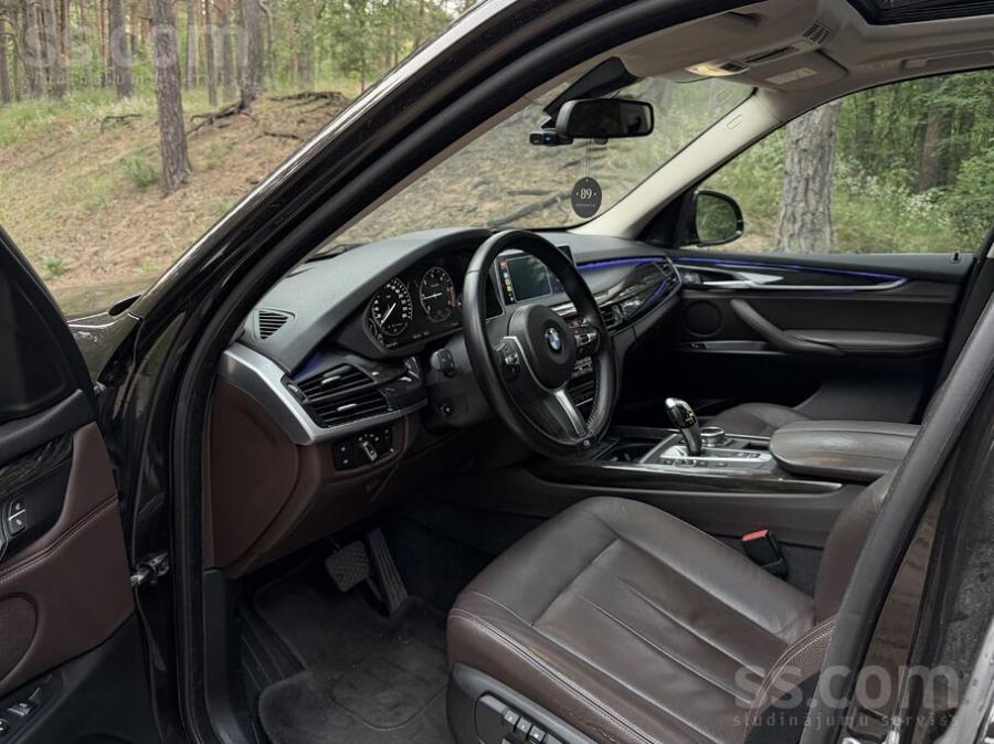 Brown BMW X5 2014 in Riga, with an engine capacity of 2.00 L and mileage of 196 thousand km for 19190 €, photo 13 on AUTOMOTO.COM.LV