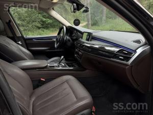 Brown BMW X5 2014 in Riga, with an engine capacity of 2.00 L and mileage of 196 thousand km for 19190 €, photo 22 on AUTOMOTO.COM.LV