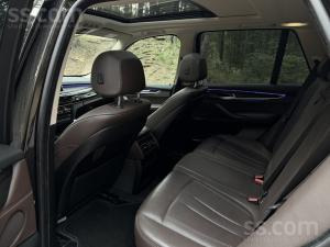 Brown BMW X5 2014 in Riga, with an engine capacity of 2.00 L and mileage of 196 thousand km for 19190 €, photo 25 on AUTOMOTO.COM.LV