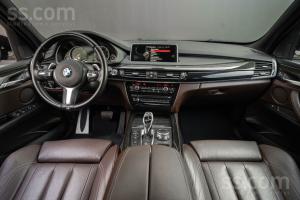Brown BMW X5 2015 in Riga, with an engine capacity of 3.00 L and mileage of 237 thousand km for 21990 €, photo 16 on AUTOMOTO.COM.LV