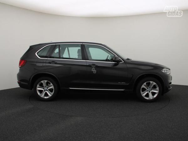 Grey BMW X5 2014 in Vilnius, with an engine capacity of 3.00 L and mileage of 236 thousand km for 19199 €, photo 9 on AUTOMOTO.COM.LV