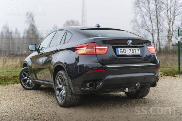 Black BMW X6 2008 in Riga, with an engine capacity of 3.00 L and mileage of 388 thousand km for 10790 €, photo 4 on AUTOMOTO.COM.LV