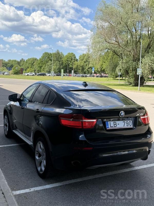Black BMW X6 2009 in Riga, with an engine capacity of 3.00 L and mileage of 366 thousand km for 10999 €, photo 4 on AUTOMOTO.COM.LV