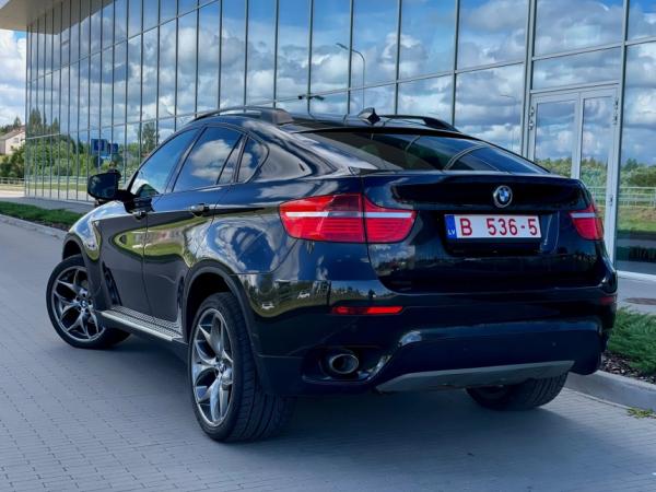 Black BMW X6 2009 in Riga, with an engine capacity of 3.00 L and mileage of 390 thousand km for 12490 €, photo 4 on AUTOMOTO.COM.LV