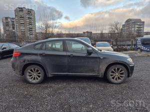Black BMW X6 2010 in Riga, with an engine capacity of 3.00 L and mileage of 228 thousand km for 14590 €, photo 5 on AUTOMOTO.COM.LV