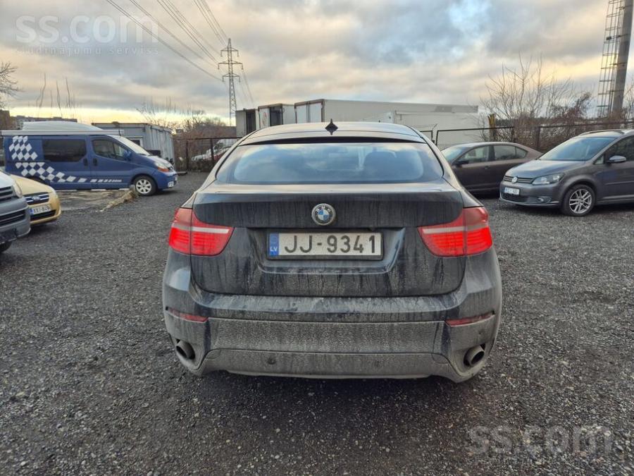 Black BMW X6 2010 in Riga, with an engine capacity of 3.00 L and mileage of 228 thousand km for 14590 €, photo 7 on AUTOMOTO.COM.LV