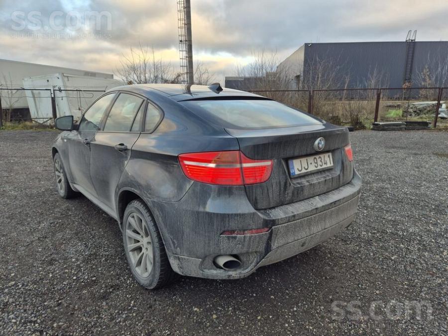 Black BMW X6 2010 in Riga, with an engine capacity of 3.00 L and mileage of 228 thousand km for 14590 €, photo 8 on AUTOMOTO.COM.LV