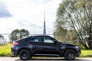 Black BMW X6 2010 in Riga, with an engine capacity of 3.00 L and mileage of 264 thousand km for 14990 €, photo 4 on AUTOMOTO.COM.LV