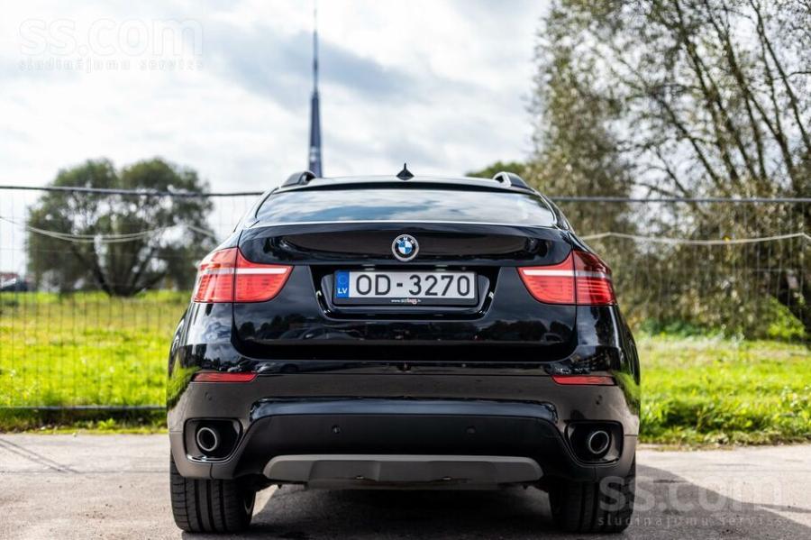 Black BMW X6 2010 in Riga, with an engine capacity of 3.00 L and mileage of 264 thousand km for 14990 €, photo 8 on AUTOMOTO.COM.LV