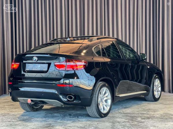 Black BMW X6 2010 in Marijampole, with an engine capacity of 3.00 L and mileage of 243 thousand km for 11750 €, photo 6 on AUTOMOTO.COM.LV