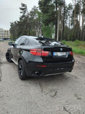 Black BMW X6 2010 in Riga, with an engine capacity of 3.00 L and mileage of 0 thousand km for 10800 €, photo 4 on AUTOMOTO.COM.LV