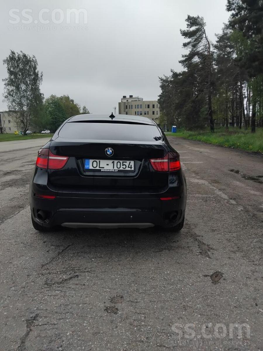 Black BMW X6 2010 in Riga, with an engine capacity of 3.00 L and mileage of 0 thousand km for 10800 €, photo 5 on AUTOMOTO.COM.LV