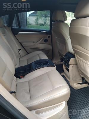 Black BMW X6 2010 in Riga, with an engine capacity of 3.00 L and mileage of 0 thousand km for 10800 €, photo 14 on AUTOMOTO.COM.LV