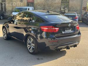 Black BMW X6 2011 in Riga, with an engine capacity of 4.40 L and mileage of 322 thousand km for 9950 €, photo 4 on AUTOMOTO.COM.LV